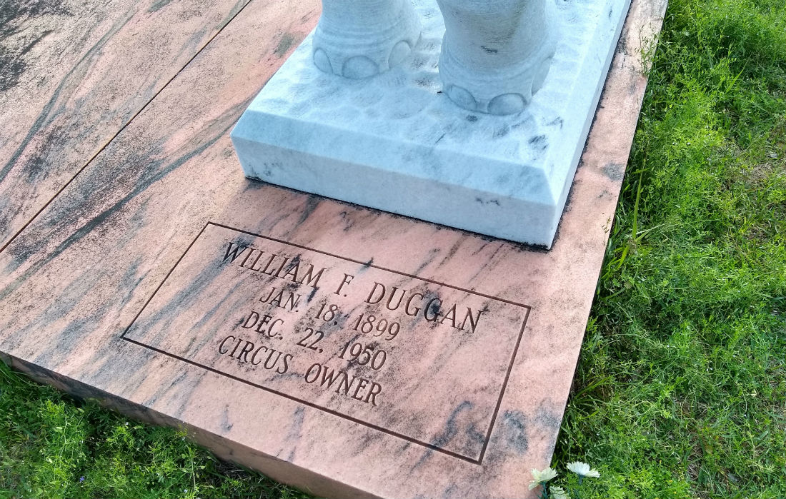 This grave in Georgia is marked by a life-sized baby elephant statue ...